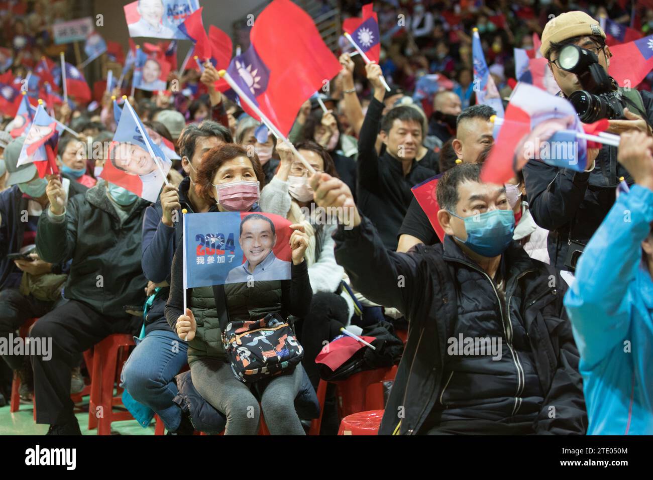 Supporters of Kuomintang (KMT) president candidate Hou Yu-ih wave flags ...