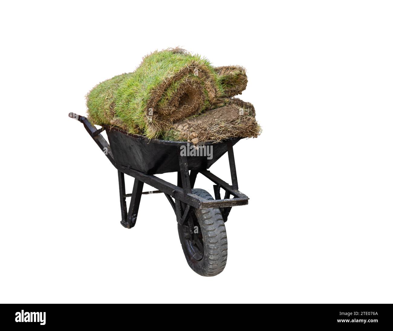 A wheelbarrow full of grass pieces to transport to the grass for the ...