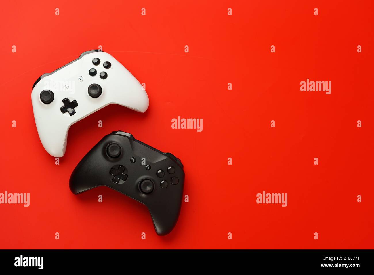 Two joystick controller on red background top view Stock Photo - Alamy