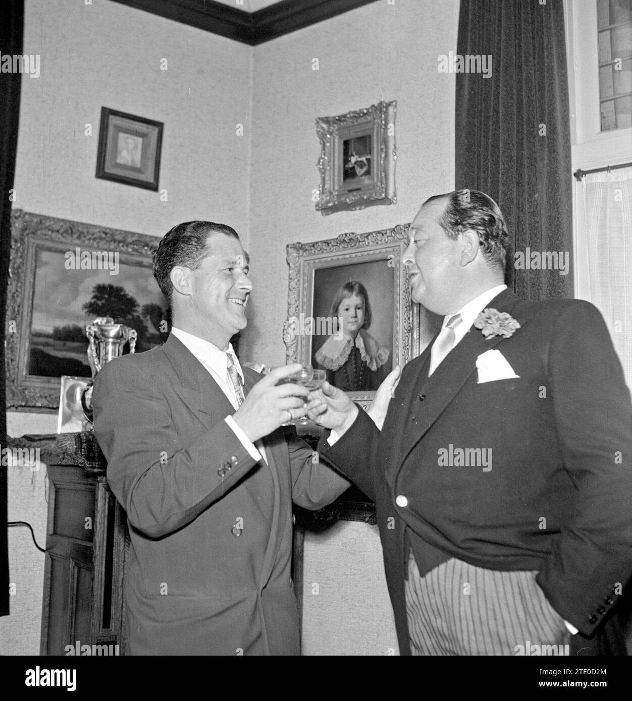 Factory director Jan van Abbe (right) toasting with an invitee ca ...