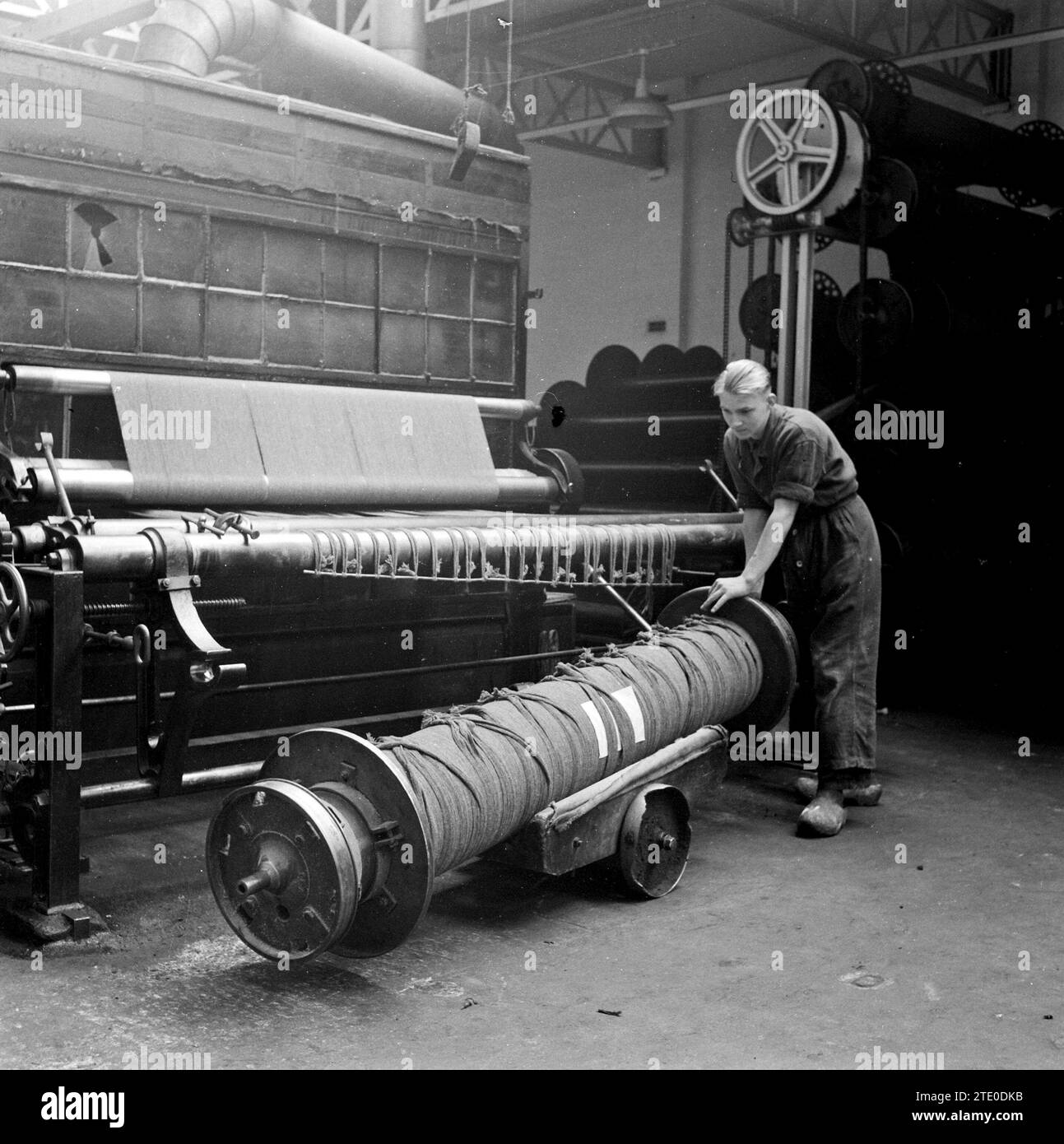 Man at work in a leather and textile manufacturing factory ca. 1945 ...