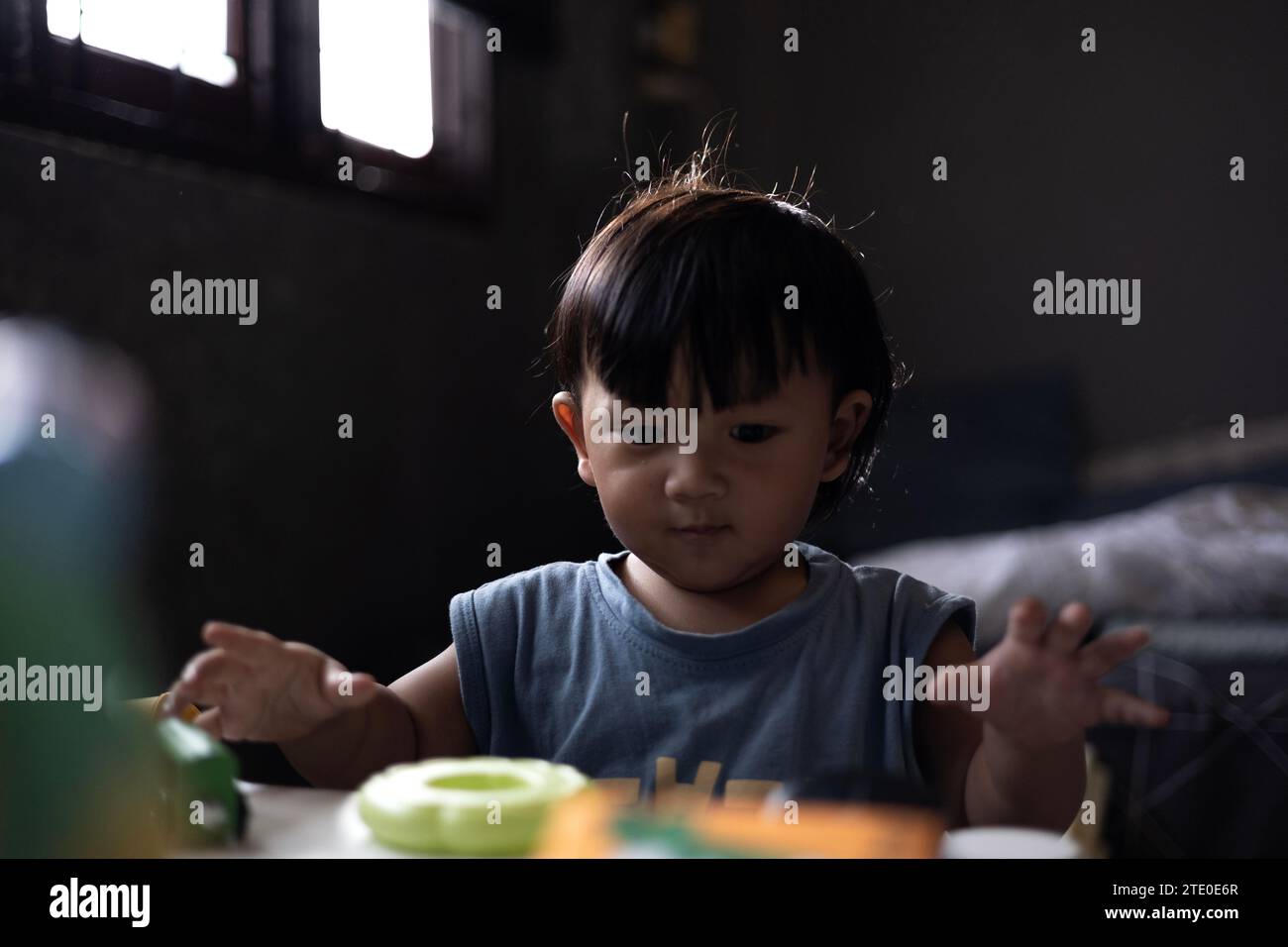 toddler play with a wooden toys at home. Toddler play with a color ...