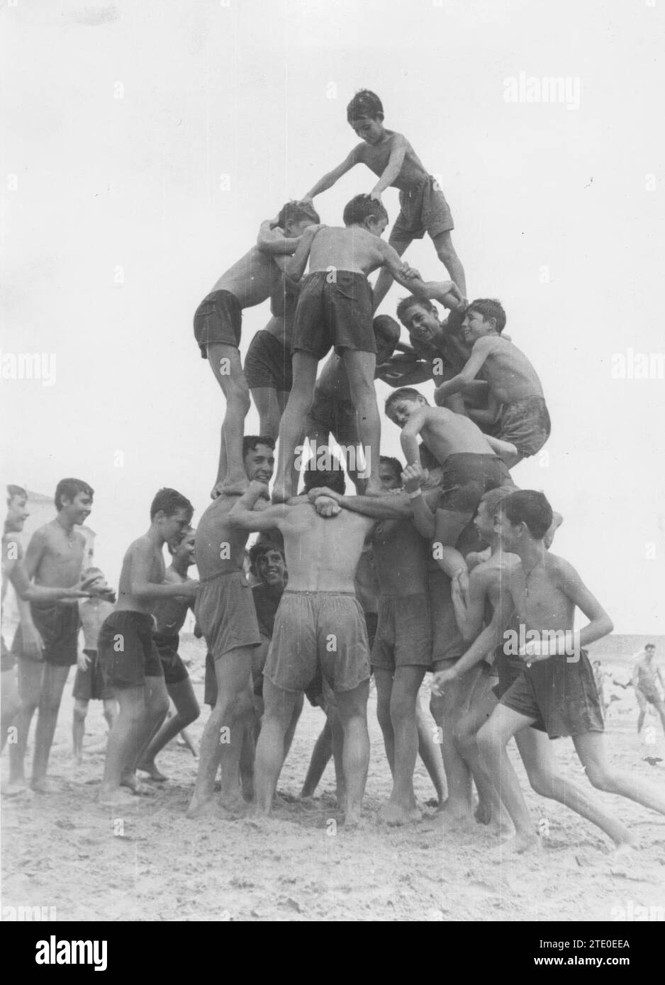 08/01/1958. Group of Young People Making a Human Pyramid on the Beach ...