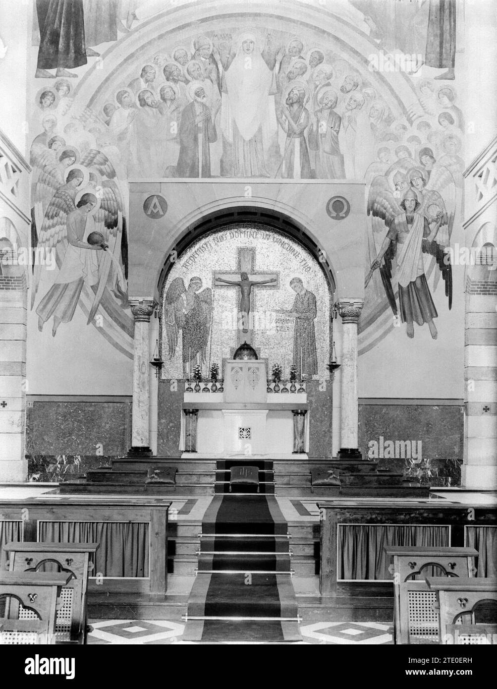 Interior of the monastery church: high altar with crucifix, mosaic and ...