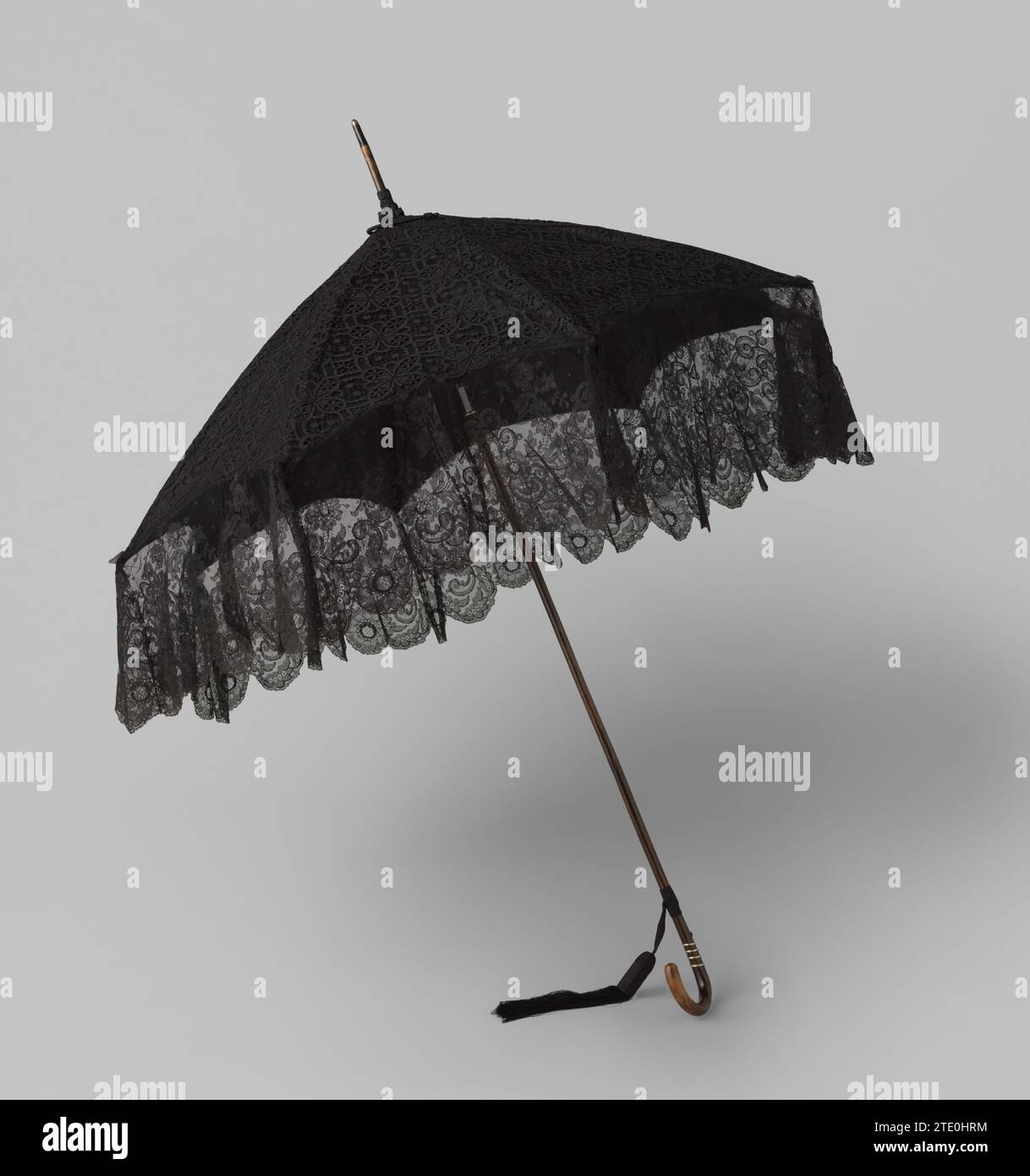 Parasol with black side on tulle, on a stick with a curved handle of ...