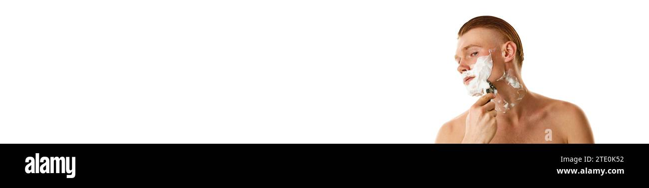 Banner. Facial grooming. Serious male model, attractive guy shaving ...