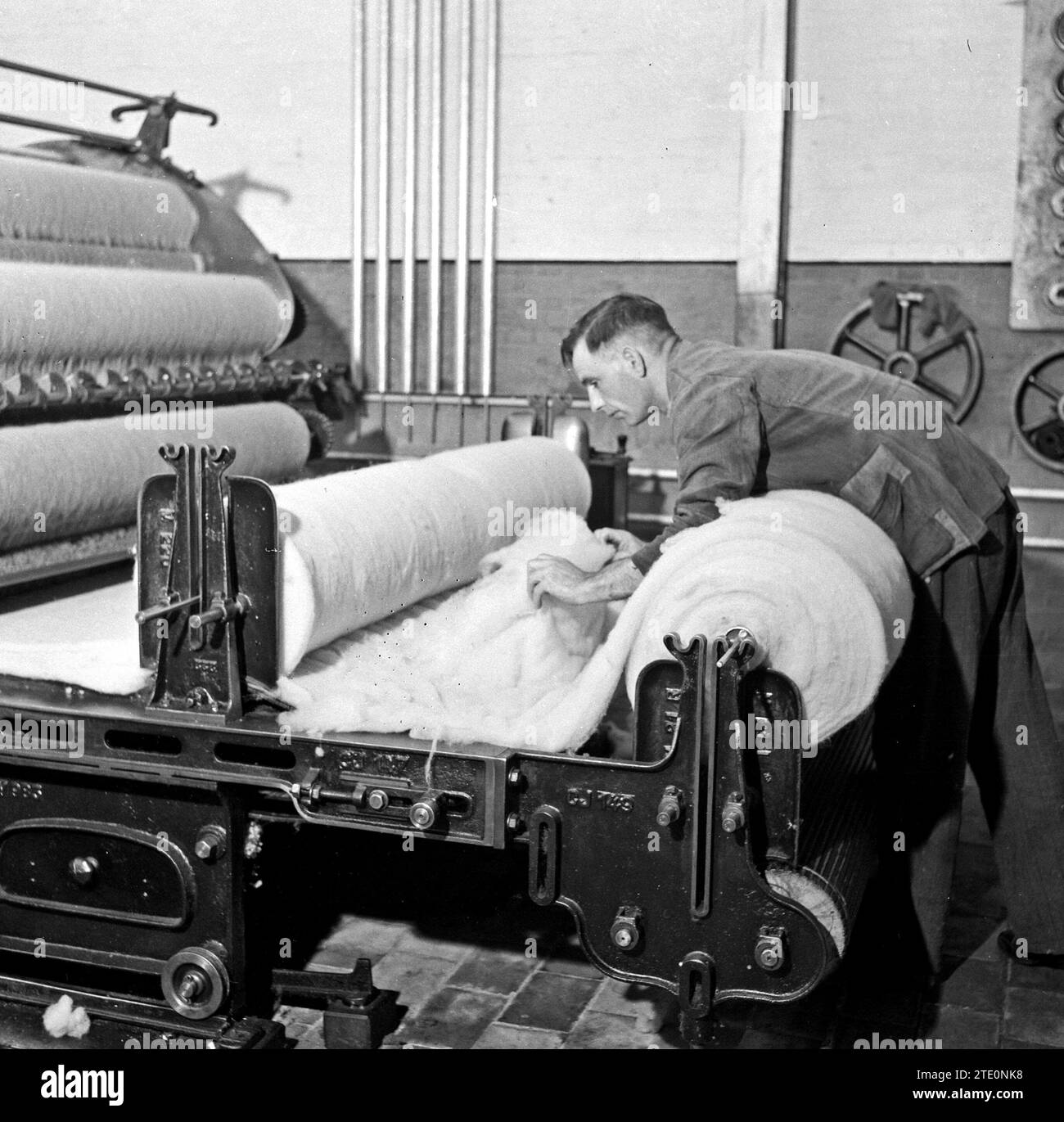 Man at work in a leather and textile manufacturing factory ca. 1945 ...