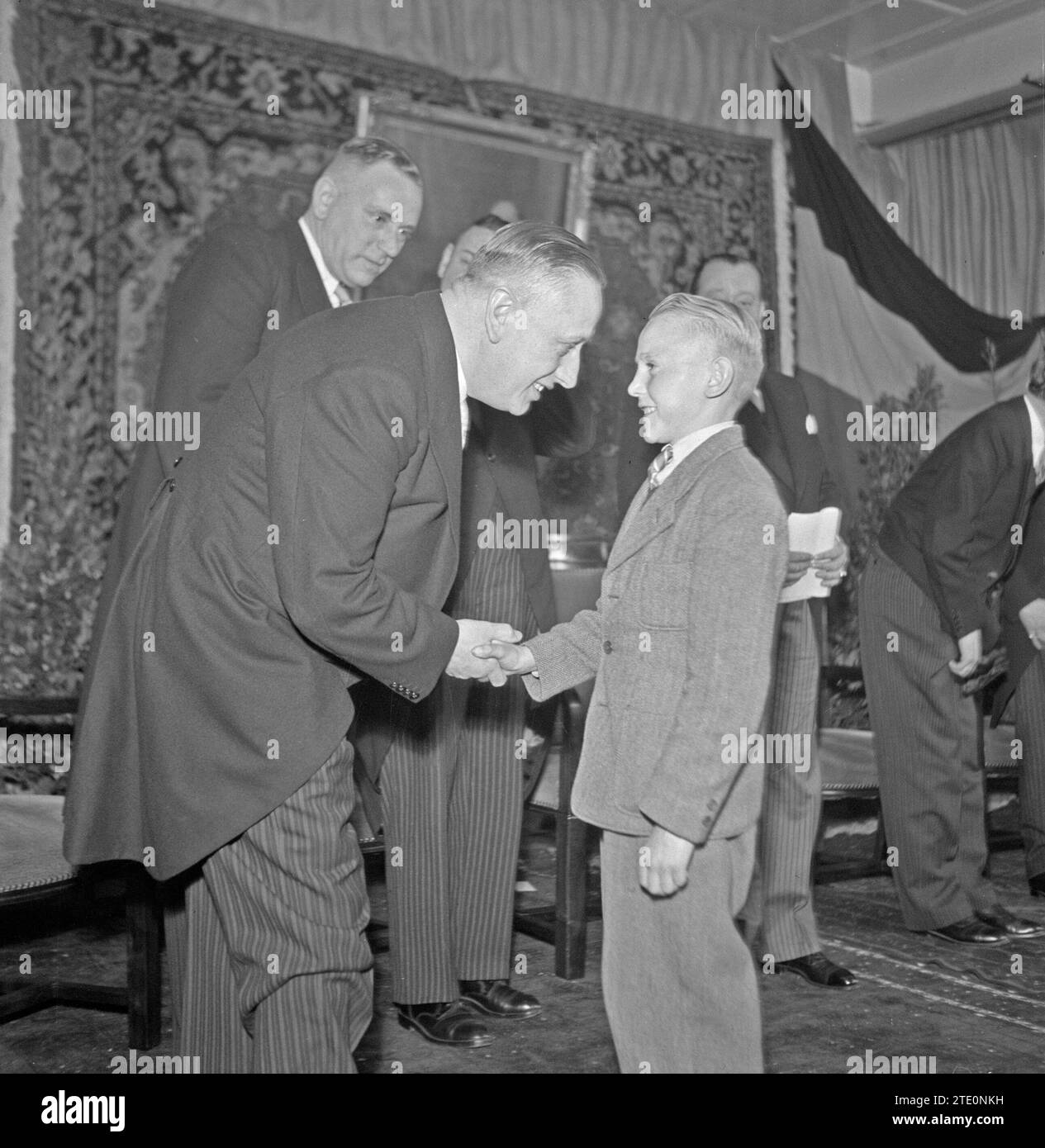Boy shakes hands with man ca. 1950 Stock Photo - Alamy