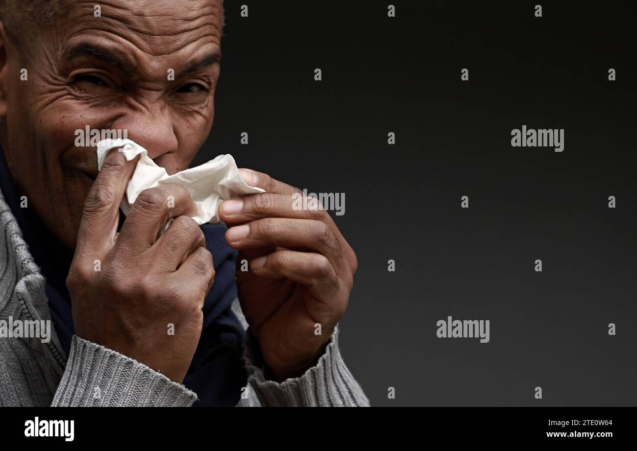 man catching the cold and flu man blowing nose after catching a cold ...