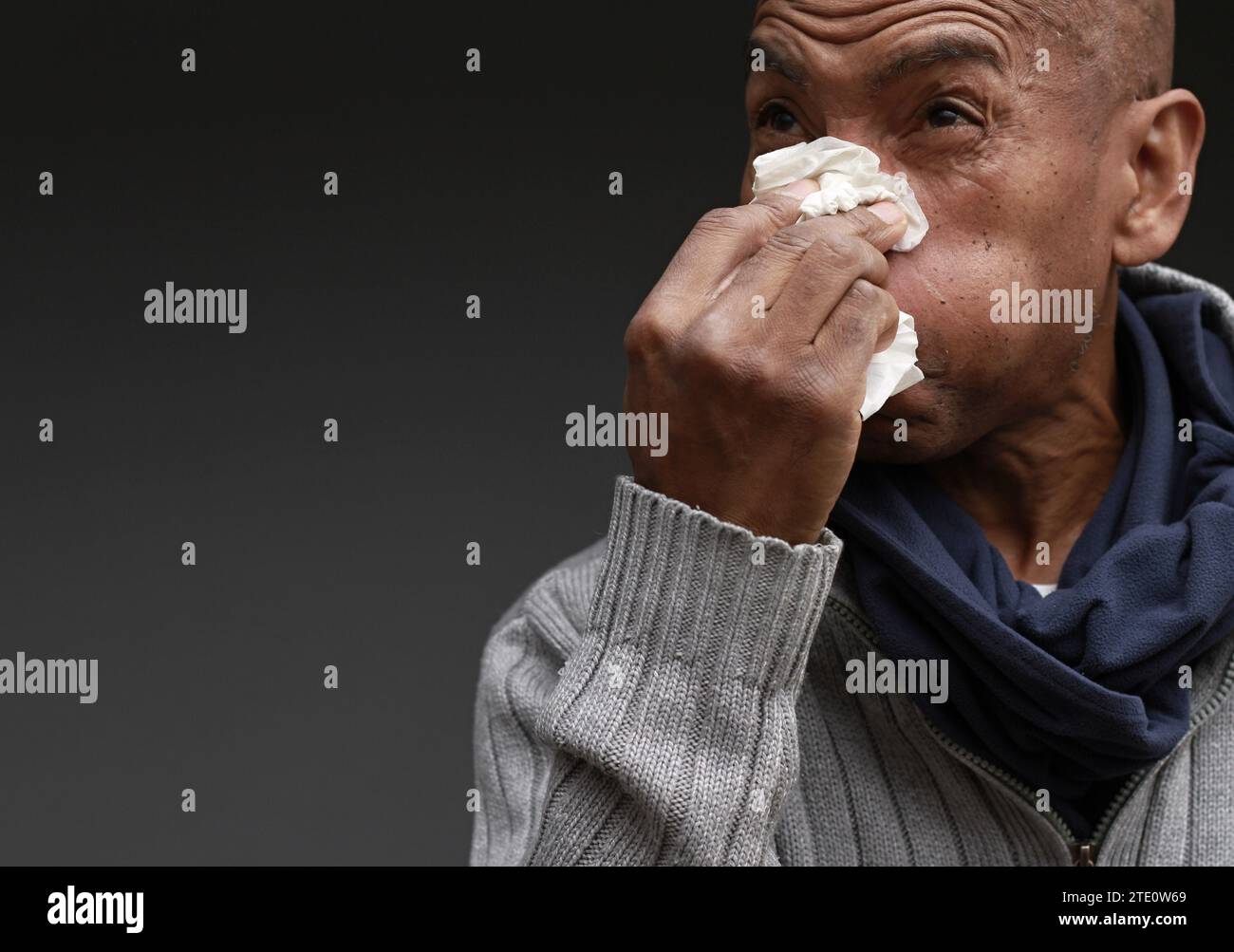 man catching the cold and flu man blowing nose after catching a cold ...