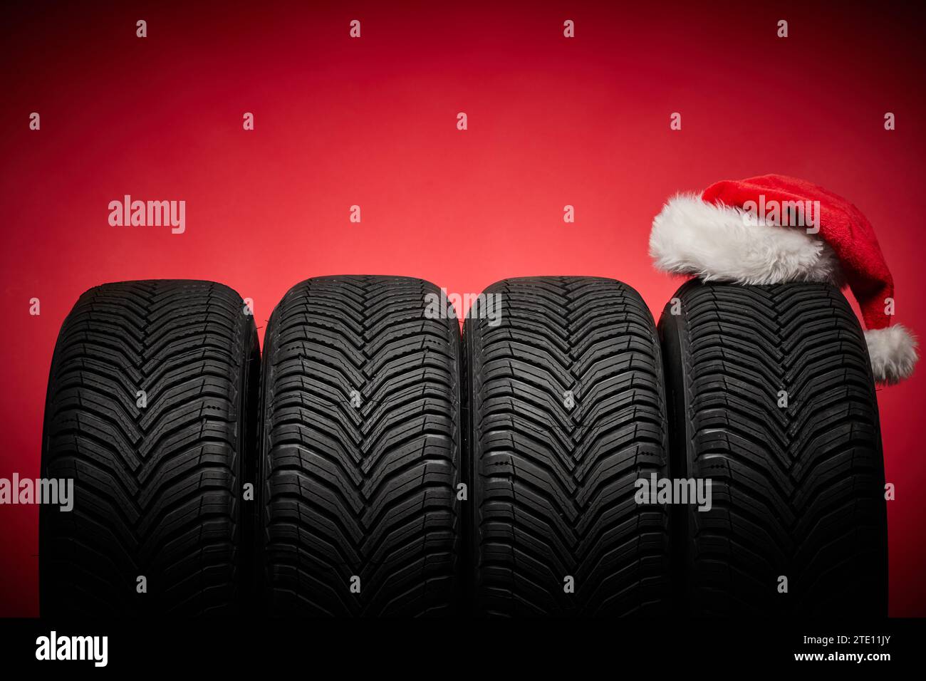 Winter car tires, big wheels and Santa Claus hat christmas red ...