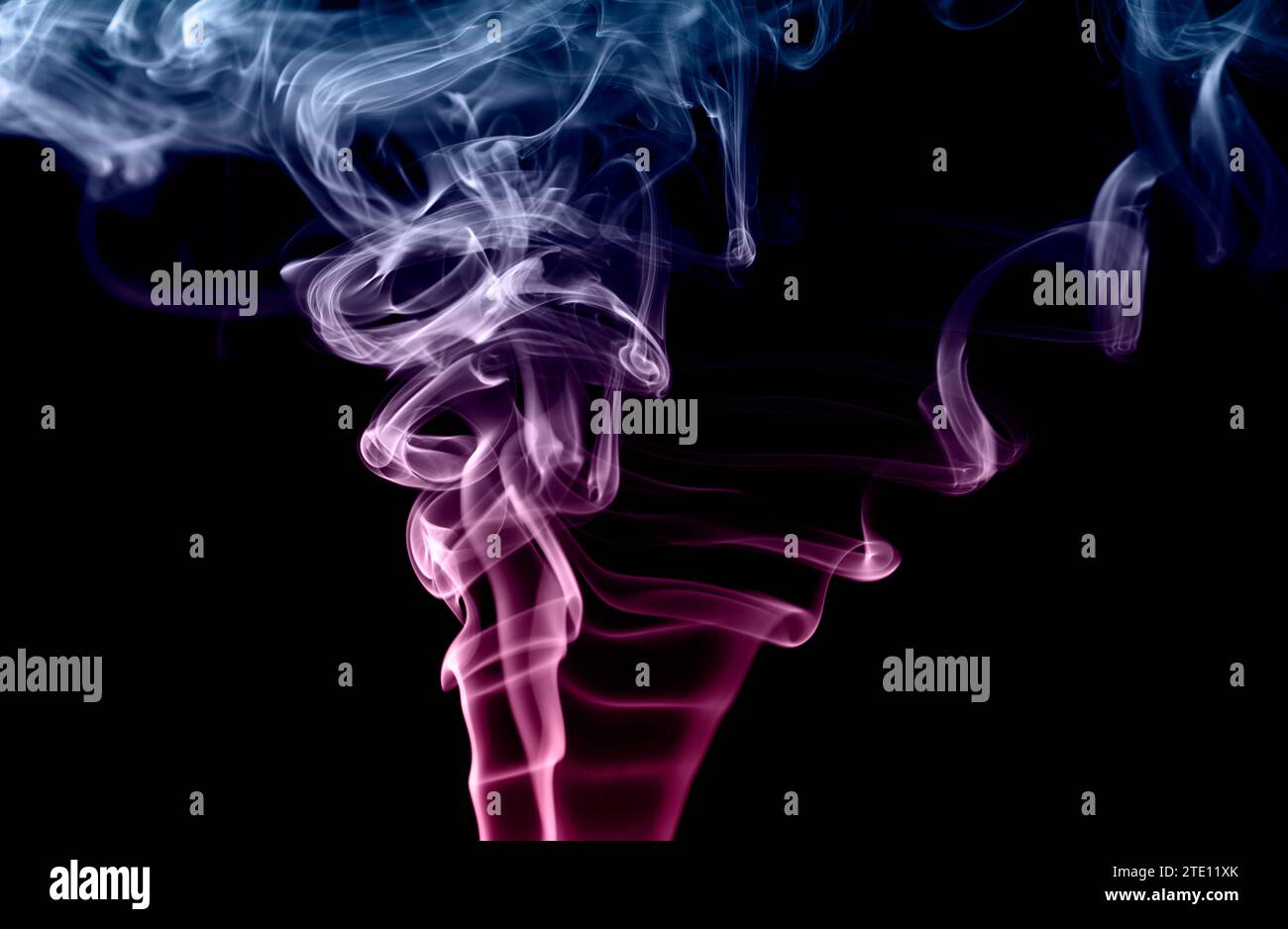 Smoke patterns photographed with high speed flash against a black ...
