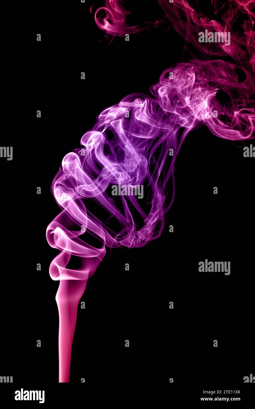 Smoke patterns photographed with high speed flash against a black ...
