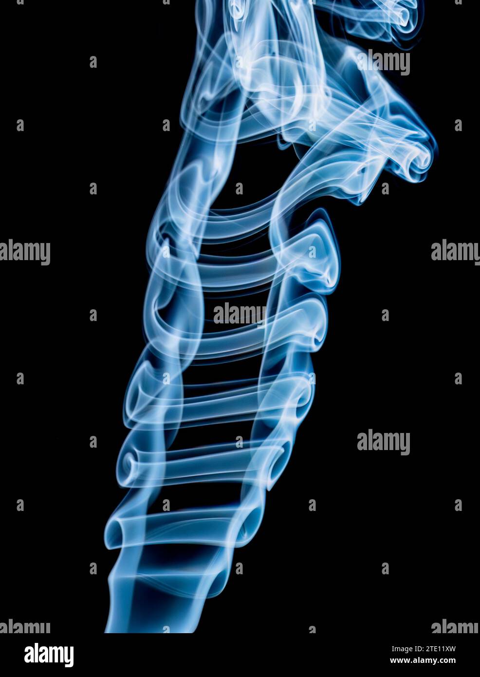 Smoke patterns photographed with high speed flash against a black ...