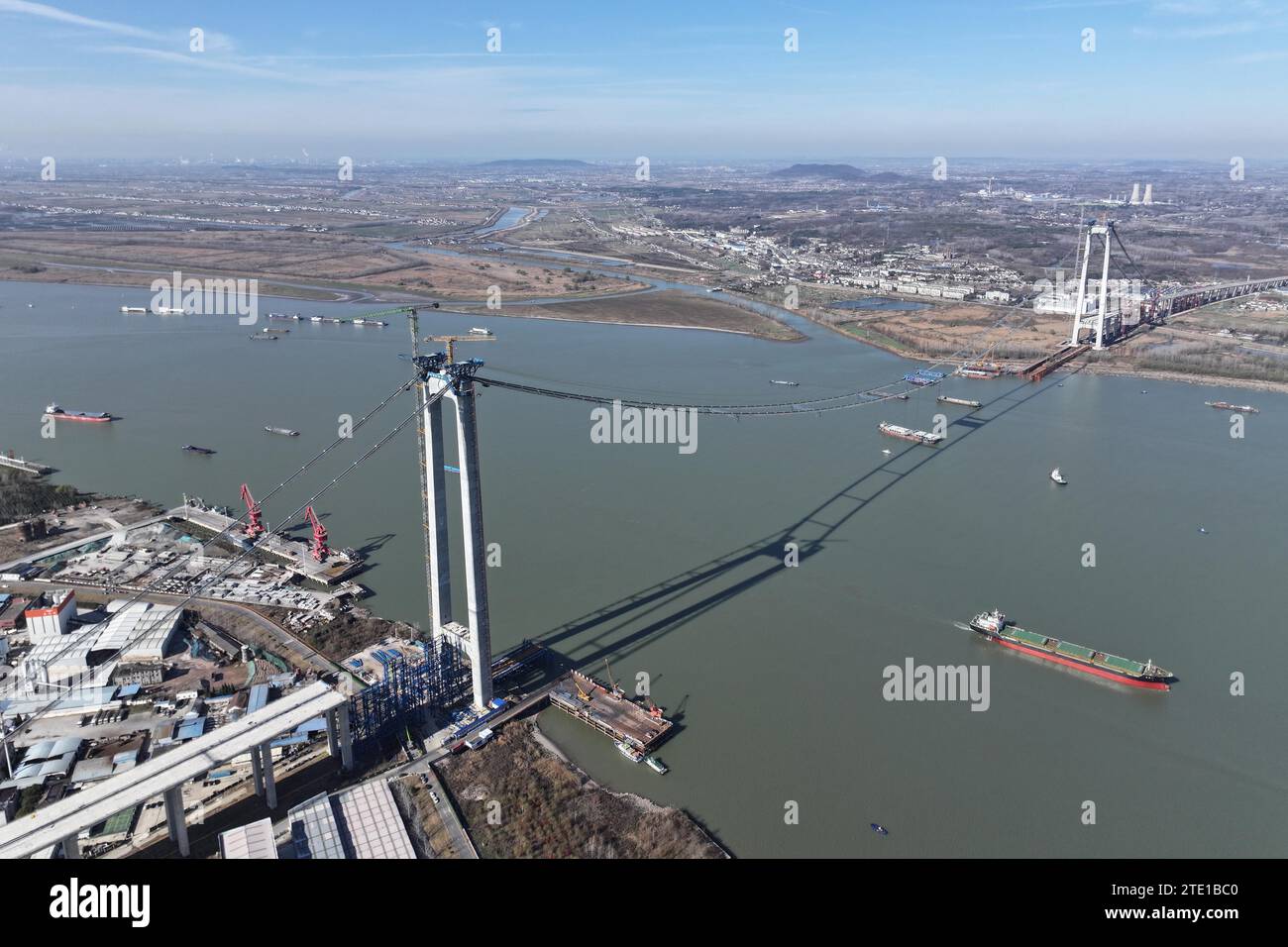 Aerial photo shows the Longtan Yangtze River Bridge under construction ...