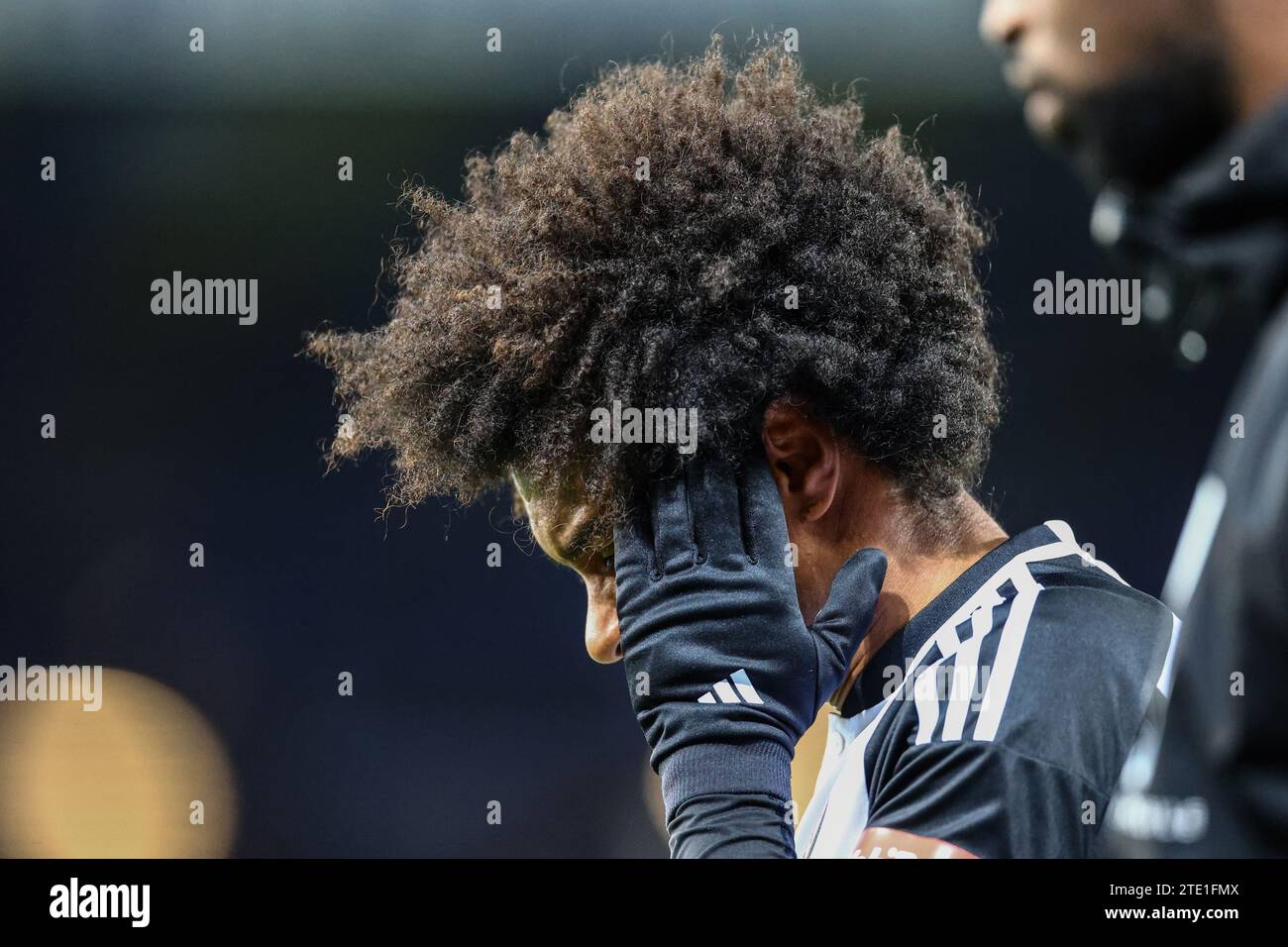 Liverpool, UK. 19th Dec, 2023. Willian of Fulham holds his face after a ...