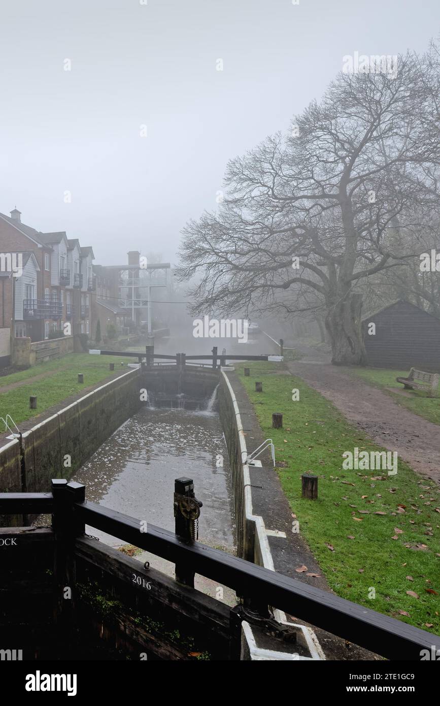 The River Wey navigation canal at Thames lock on a very foggy and misty ...