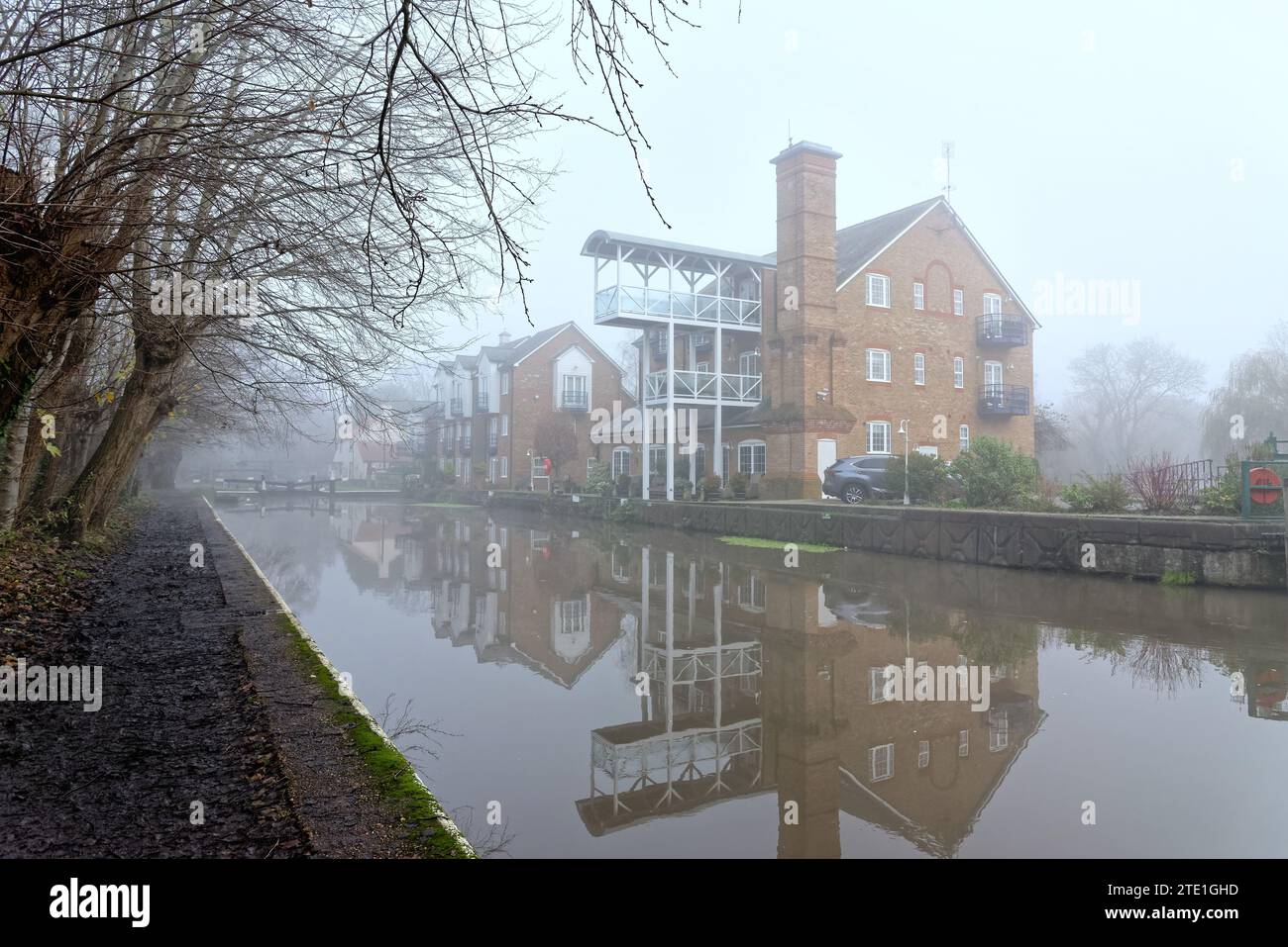 The River Wey navigation canal at Thames lock on a very foggy and misty ...