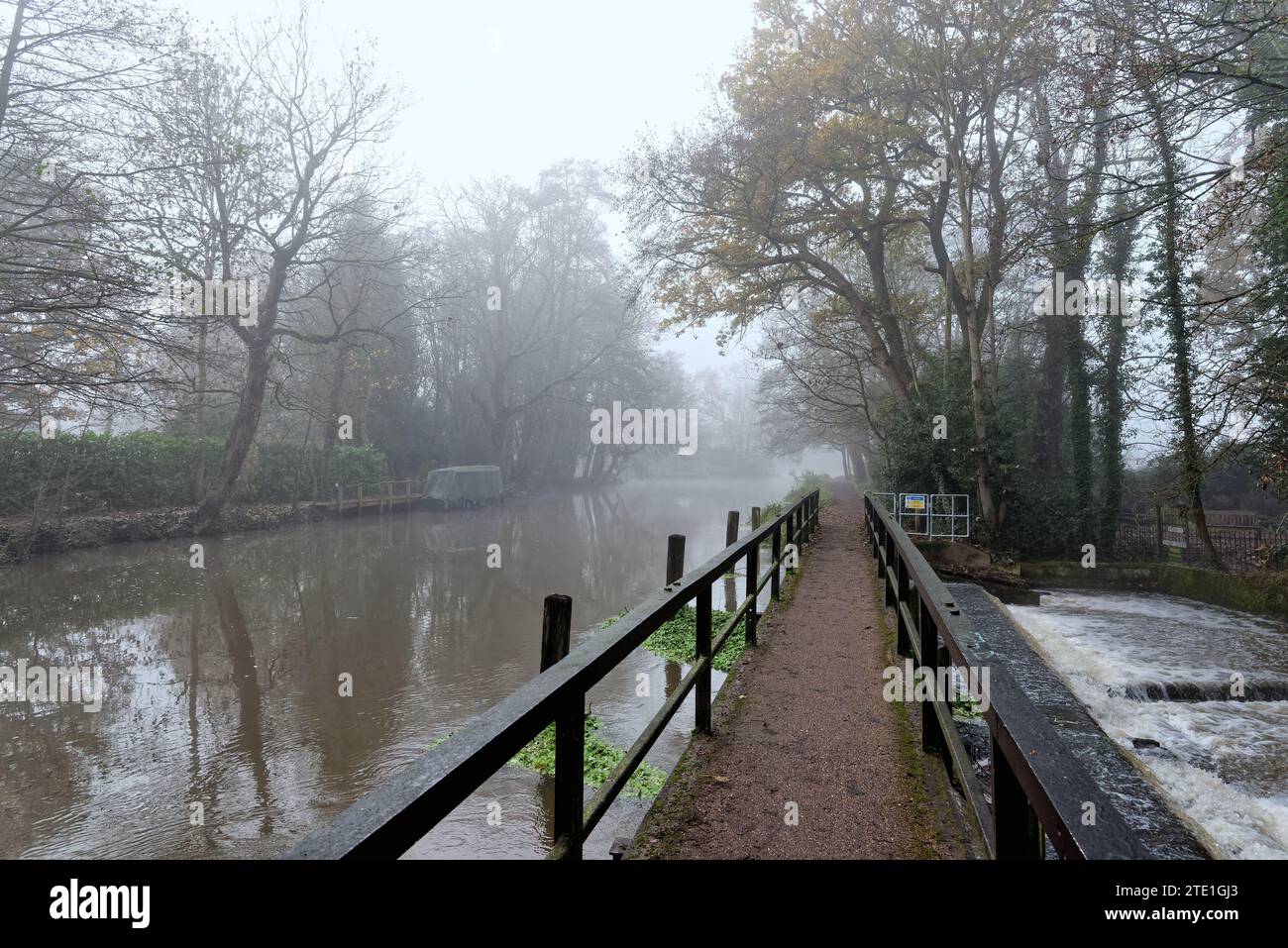 The River Wey navigation canal on a cold and foggy winter's day ...