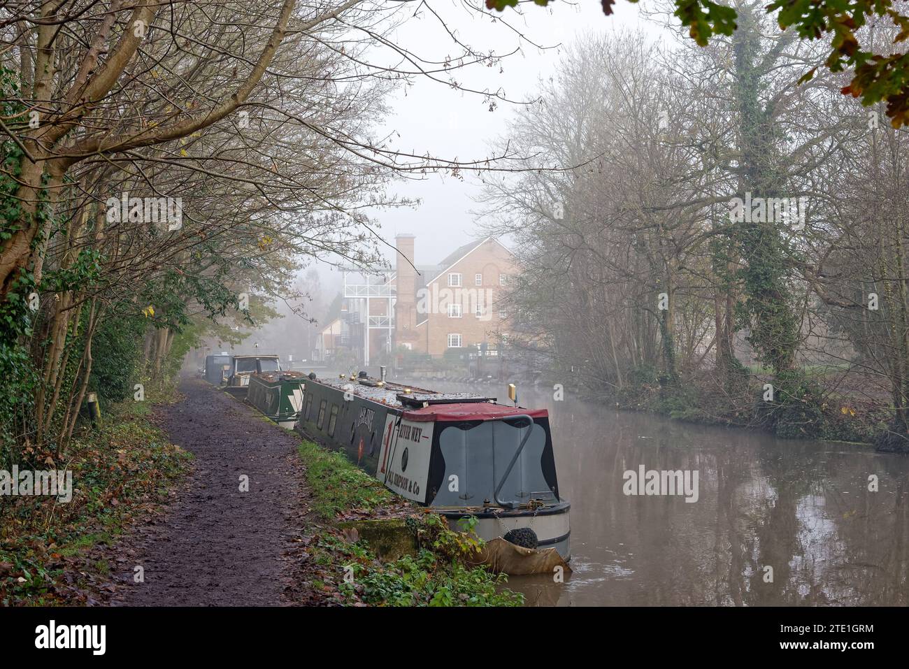 The River Wey navigation canal at Thames lock on a very foggy and misty ...