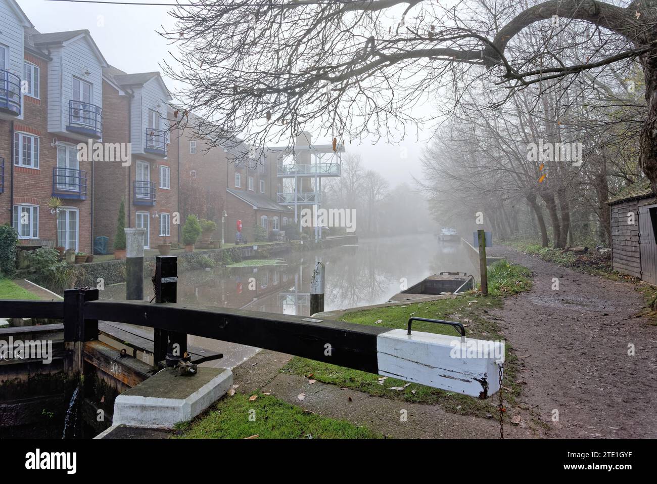The River Wey navigation canal at Thames lock on a very foggy and misty ...
