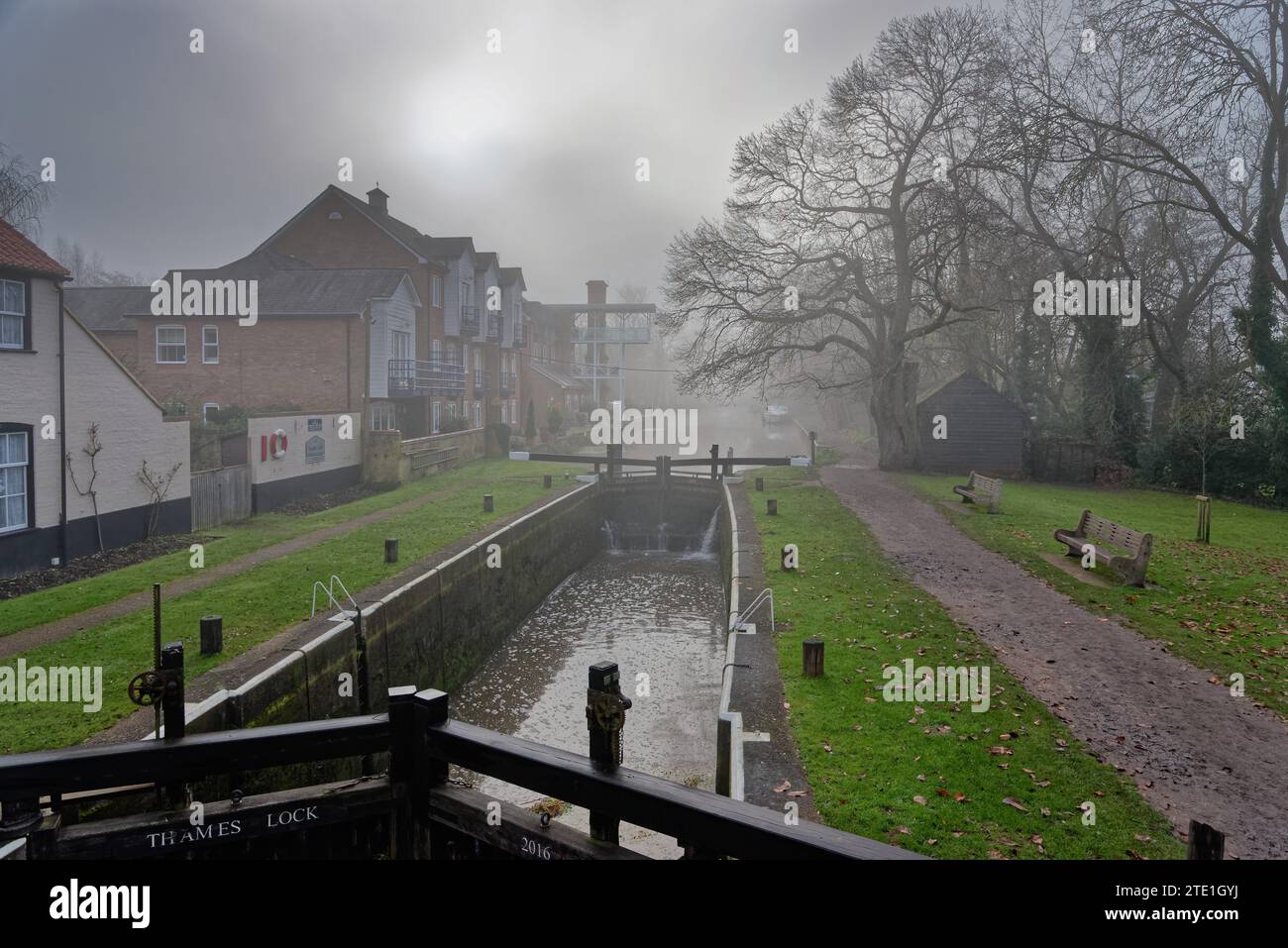 The River Wey navigation canal at Thames lock on a very foggy and misty ...