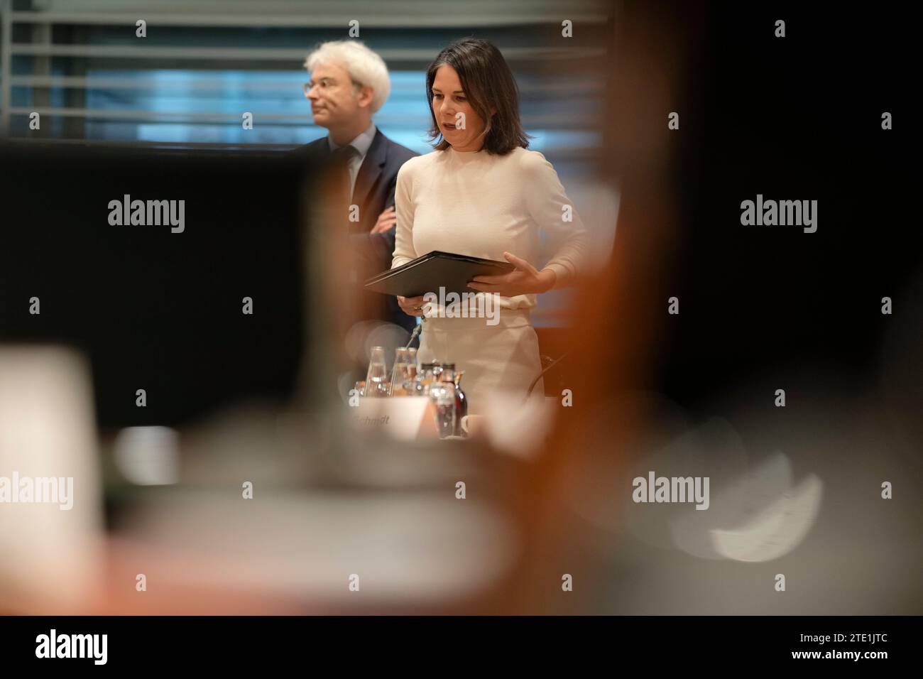 German Foreign Minister Annalena Baerbock holds a folder as she arrives for the cabinet meeting ...