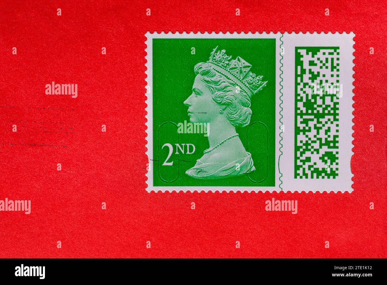 green 2nd class stamp with Queen Elizabeth II head, stuck on red ...