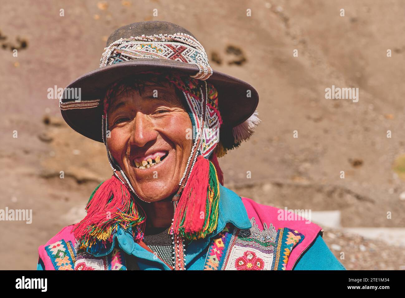 Happy native peruvian man with typical colorful at rainbow mountain ...