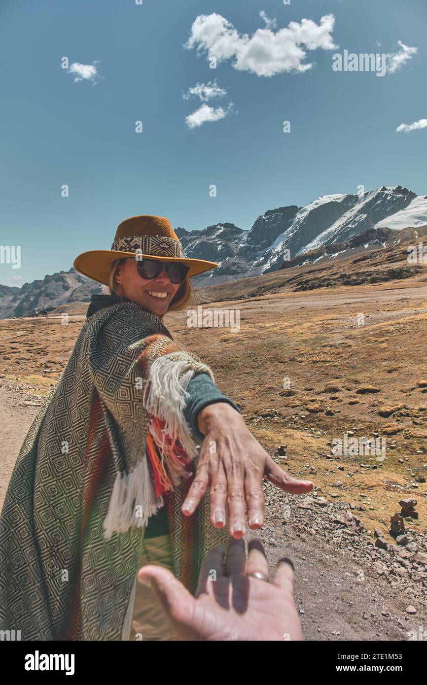 Closeup Young woman holding man hand while leading him on the rainbow ...