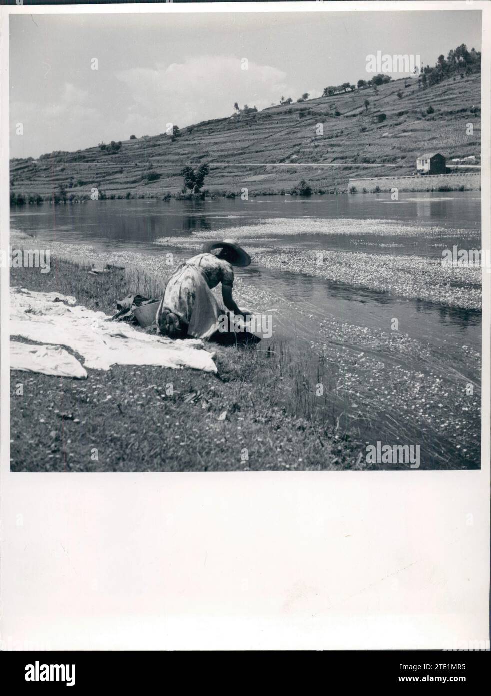 Puertomarín (Lugo), 1960 (ca.). A washerwoman on the banks of the Miño ...