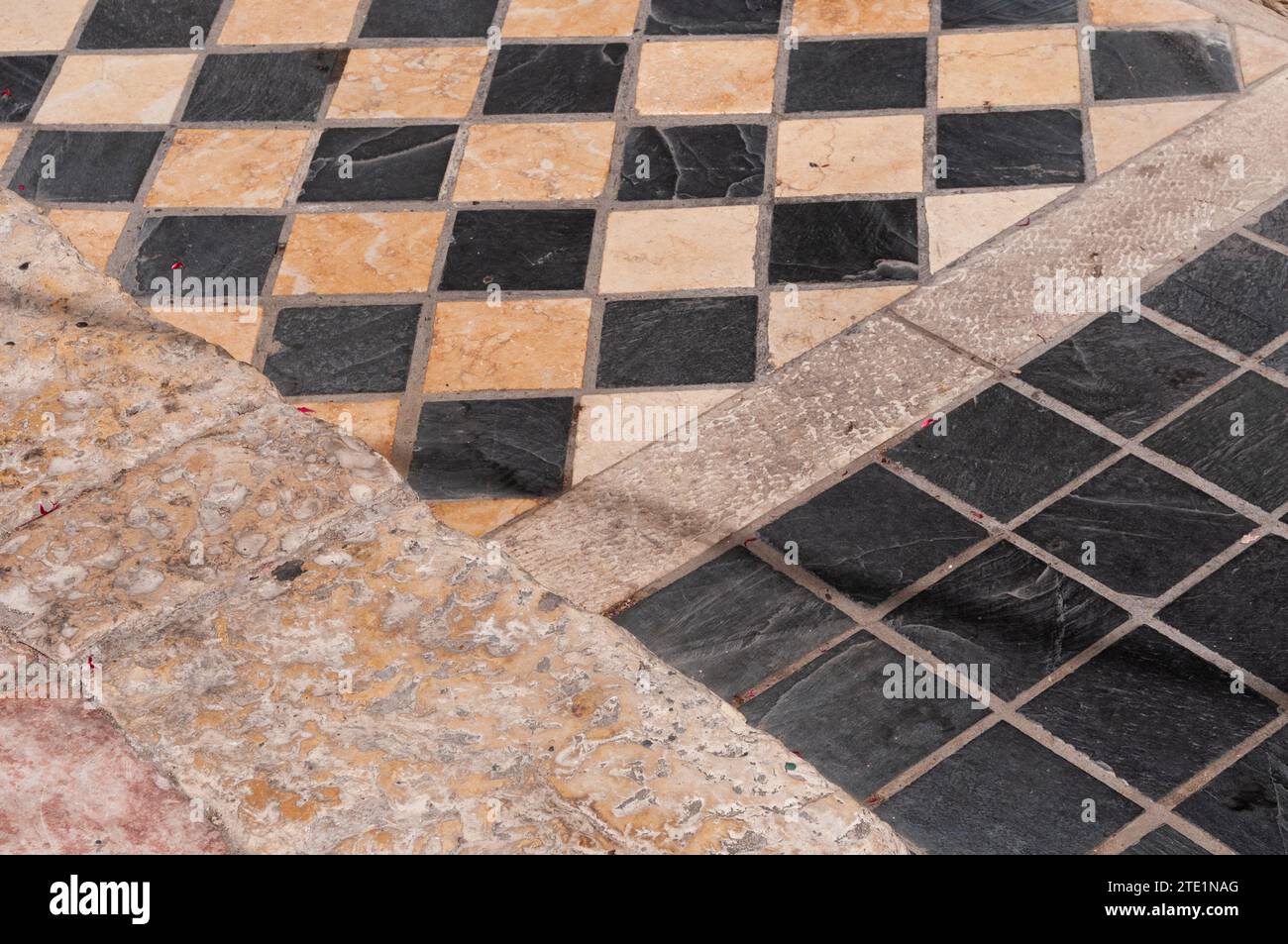 High-angle view of a vintage, diamond and black square pattern layout ...