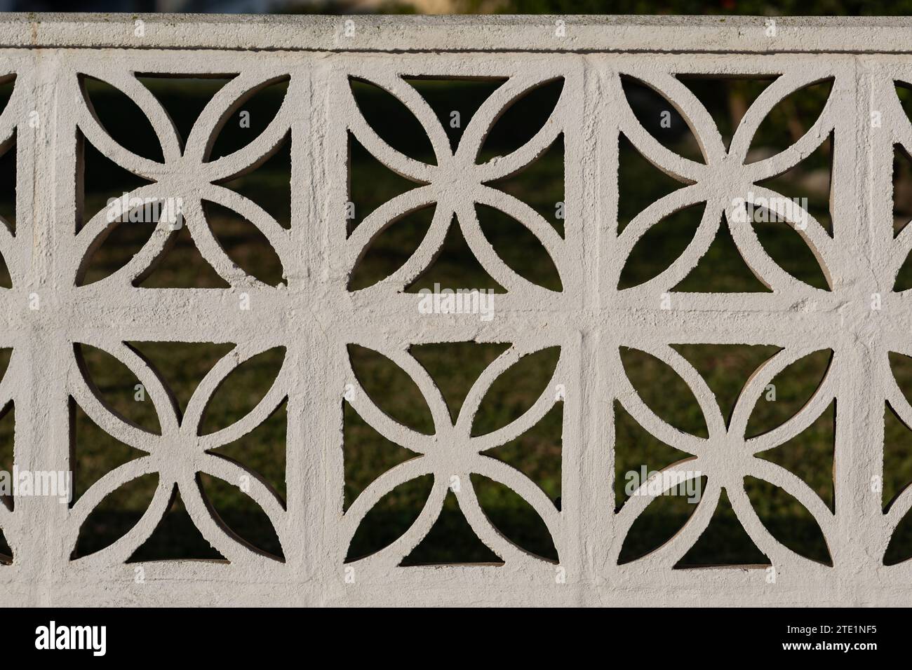 Intricate, stone blocks with curly design built into a property border ...