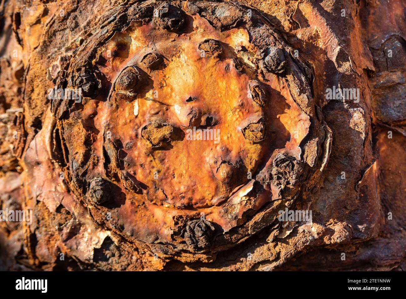 Side view of an abstract, metal, rusted, cracking, chipped and decaying ...