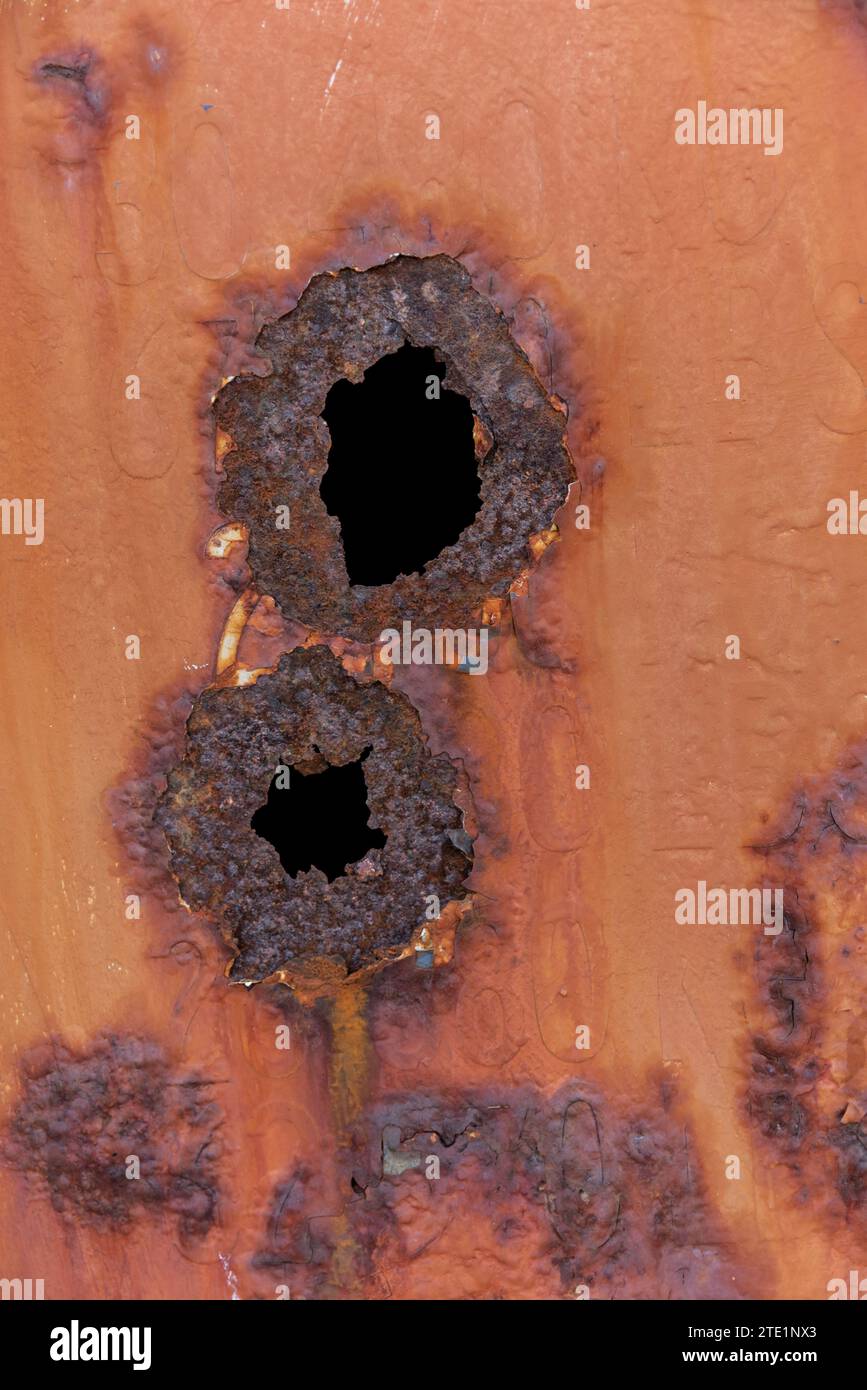 An old, discarded, rusty fuel tank with large holes Stock Photo - Alamy