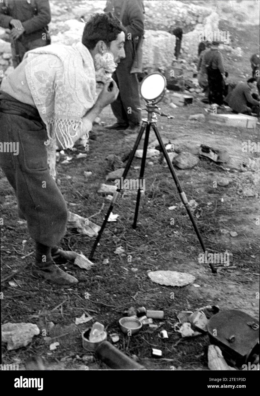 12/31/1936. A soldier shaving, using the campaign heliograph as a ...