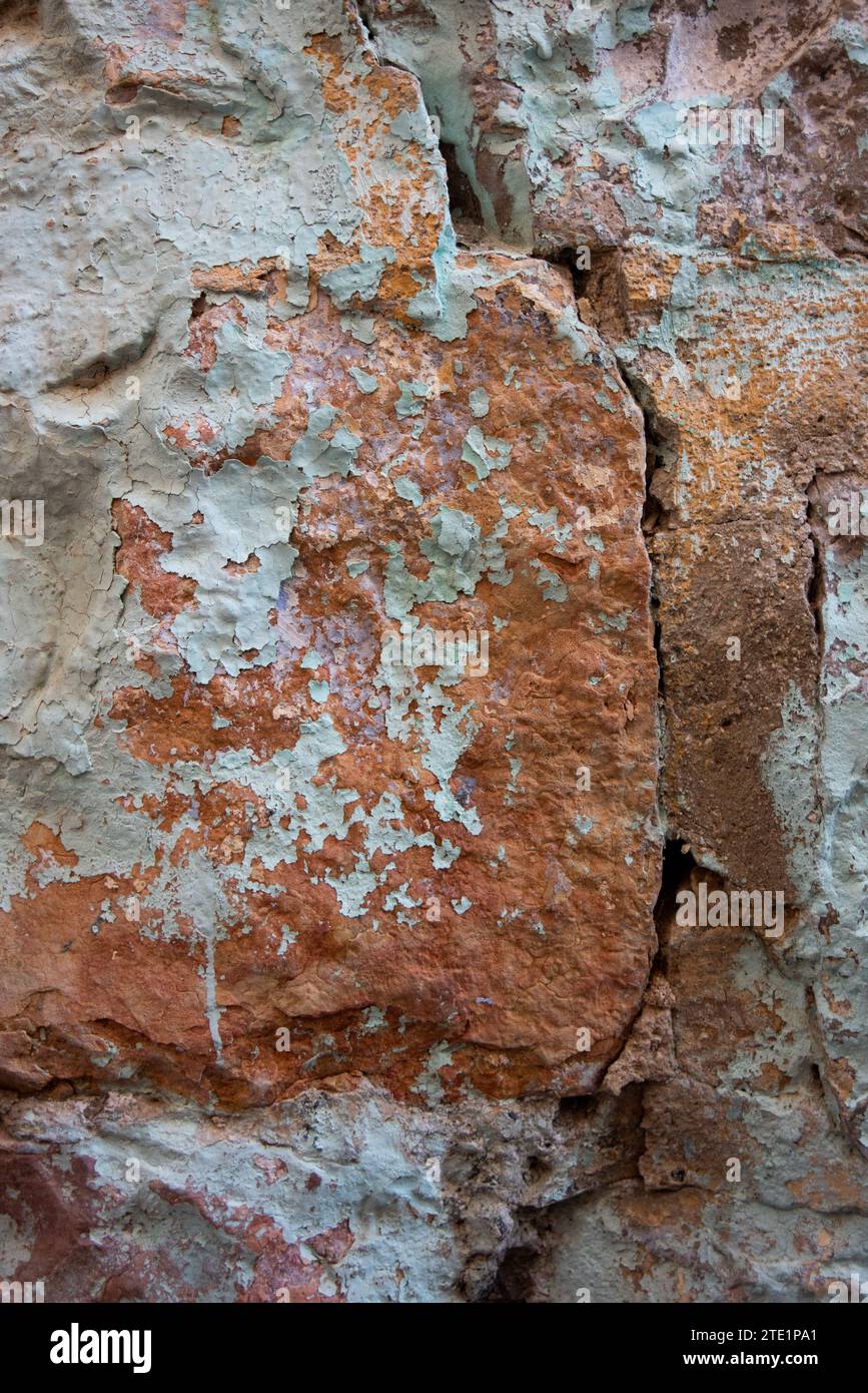 Abstract detail of the exterior stone wall of a building revealing old ...