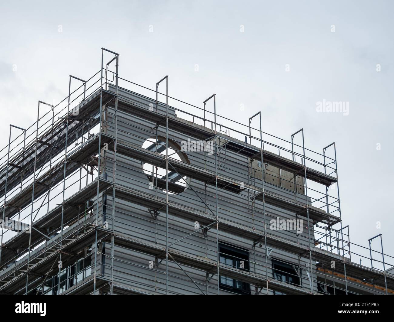 Scaffolding on a construction site of a residential building. The ...