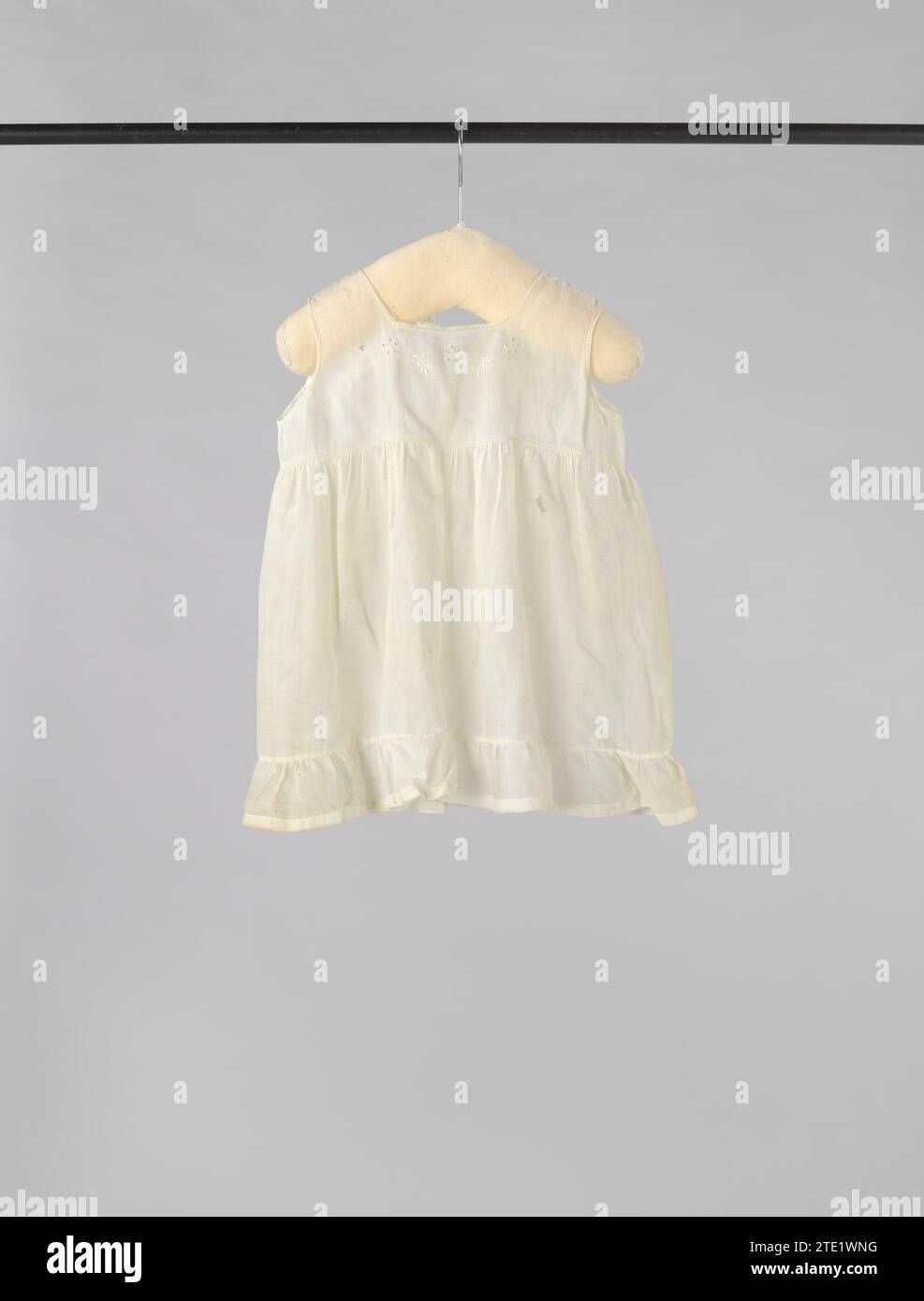 Sleeveless children's dress from white batist (?), Decorated with ajour ...