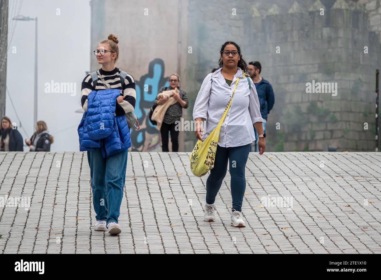 People walking through the streets of Porto Stock Photo - Alamy