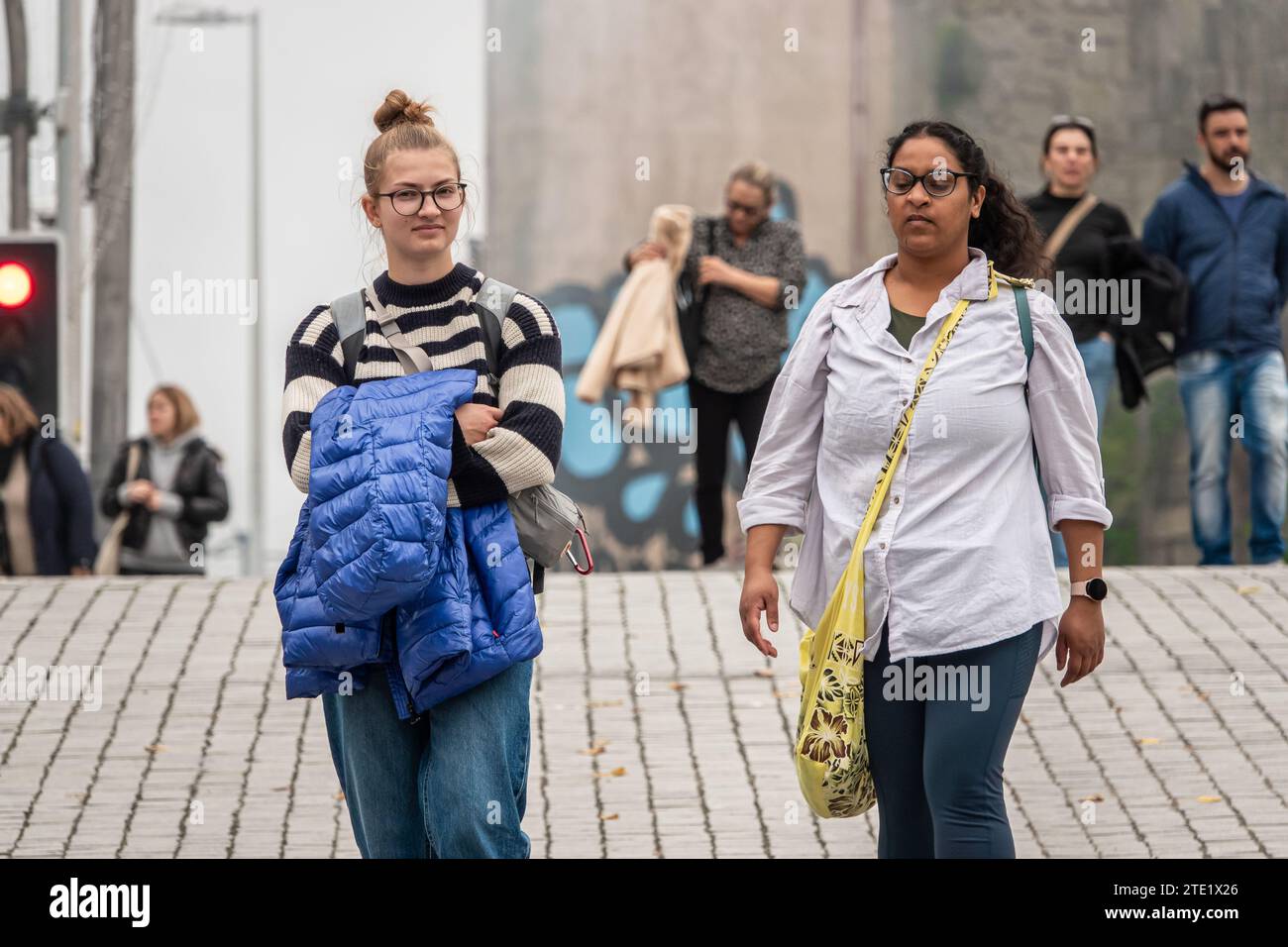 People walking through the streets of Porto Stock Photo - Alamy