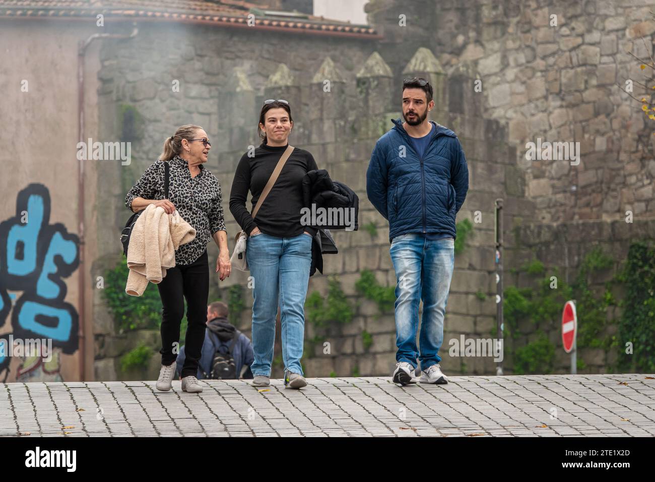 People walking through the streets of Porto Stock Photo - Alamy