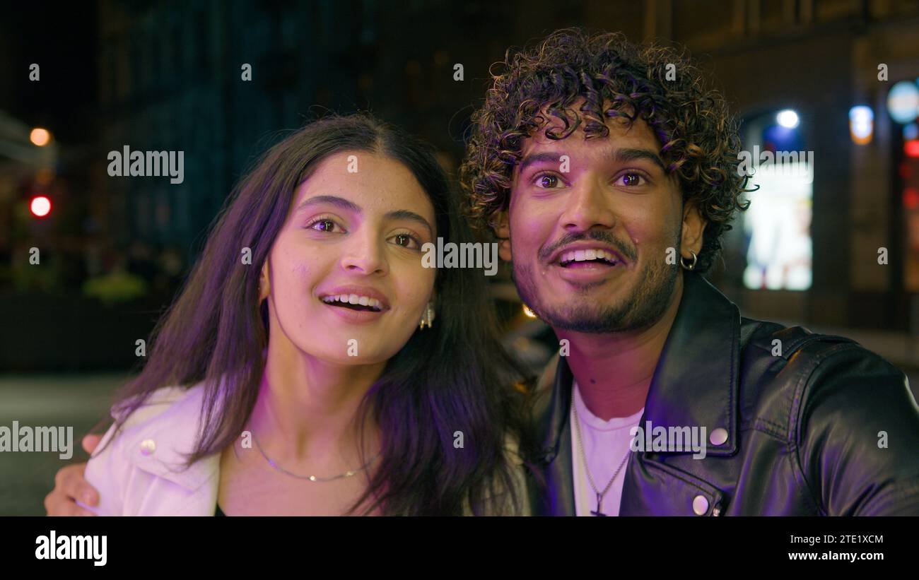 Arabian Indian happy couple in love in evening city dating urban street ...