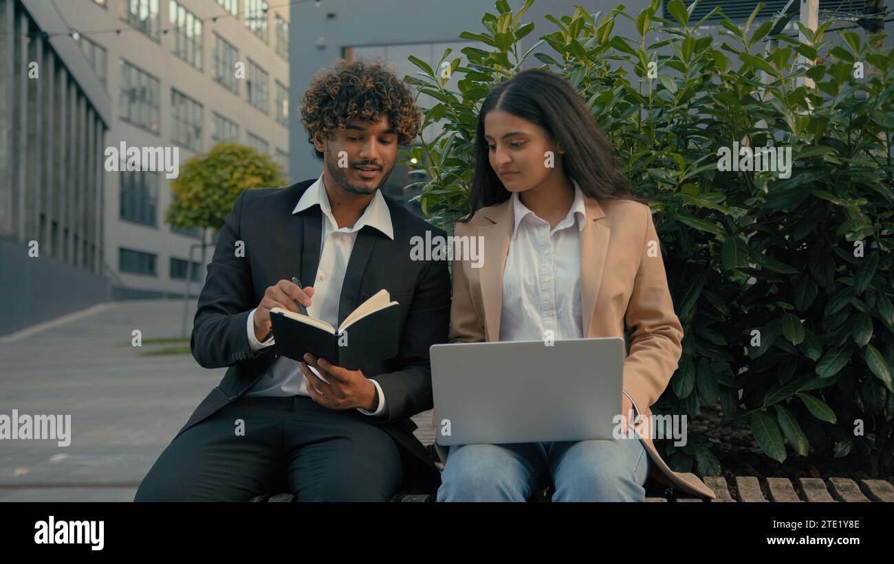 Indian businessman and Arabian businesswoman business partners ...