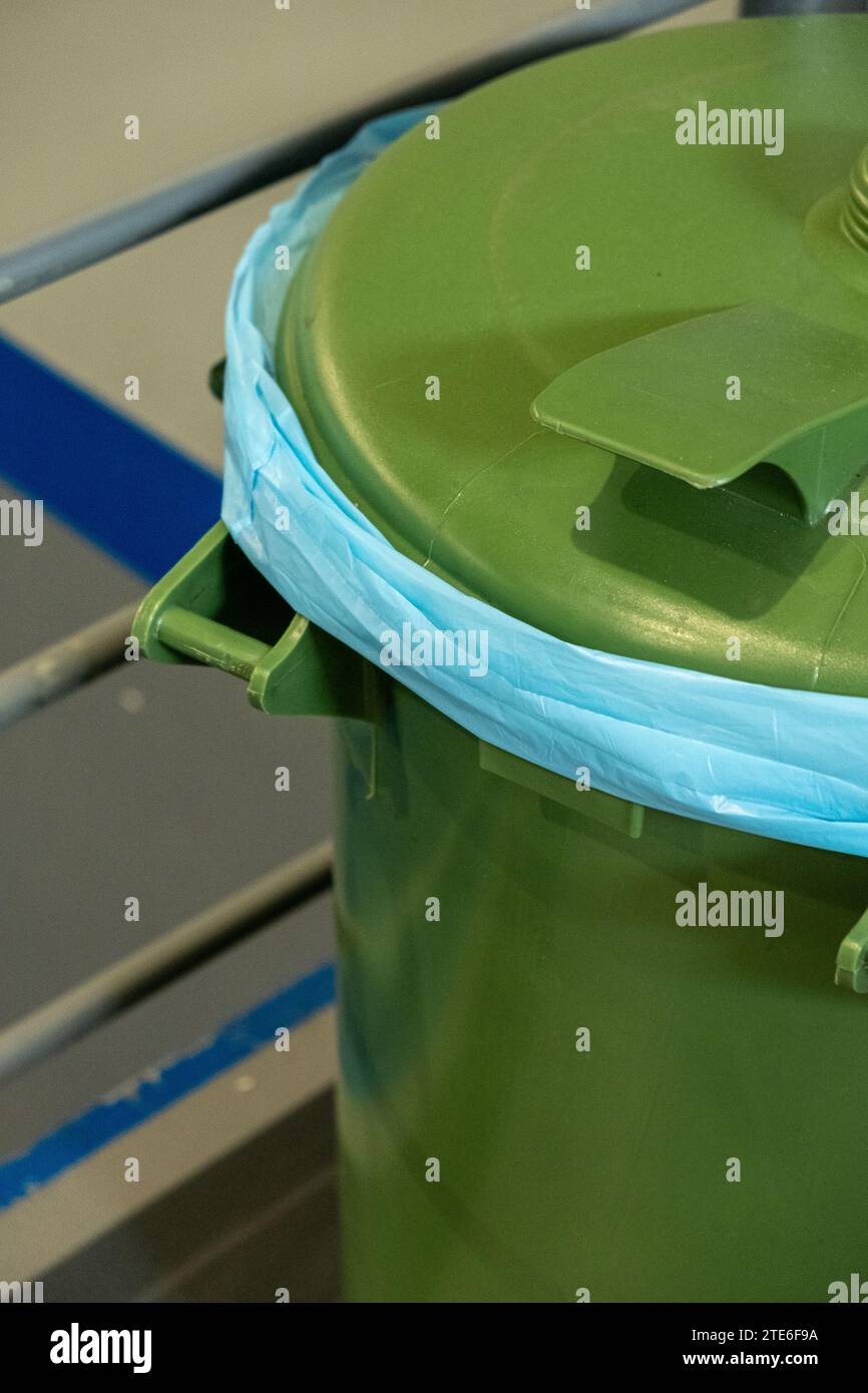 detail of a green plastic trash can Stock Photo - Alamy
