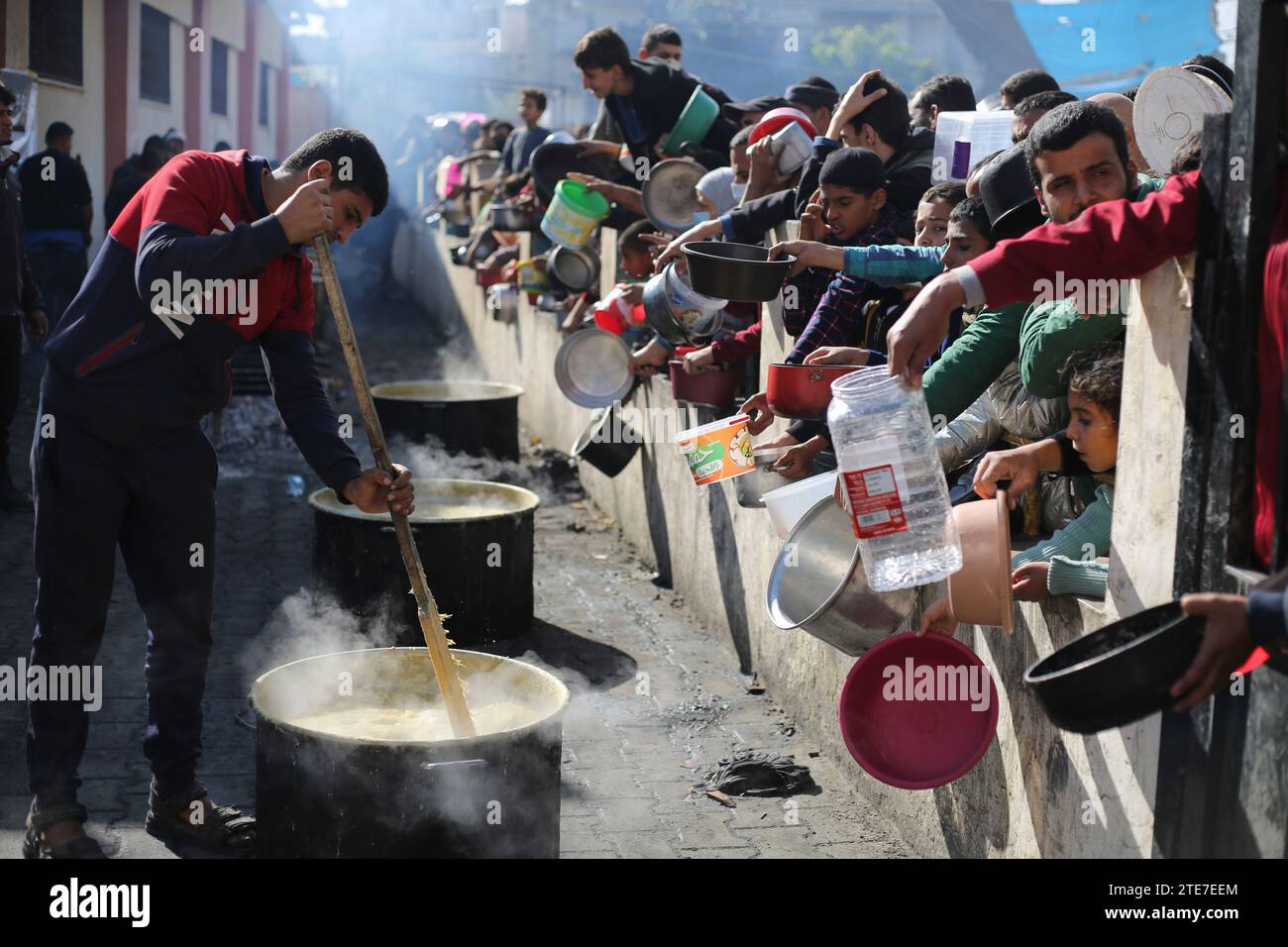 Palestinians line up for a free meal in Rafah, Gaza Strip, Wednesday ...
