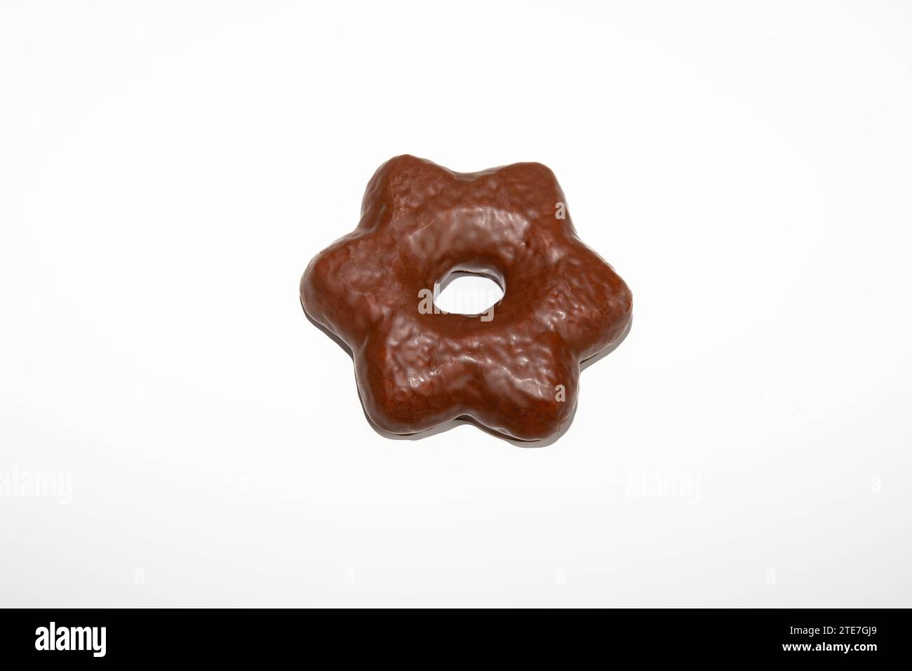 Gingerbread star biscuit covered in chocolate and isolated on white ...