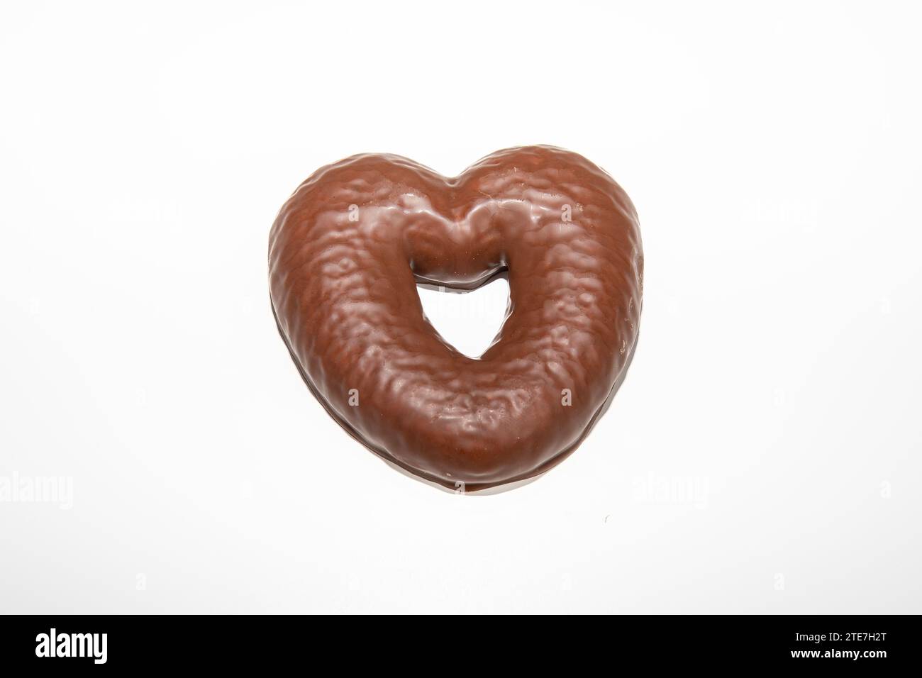 Gingerbread heart biscuit covered in chocolate and isolated on white ...