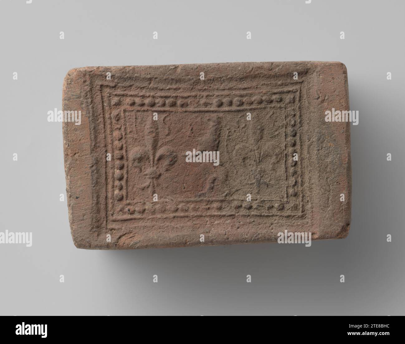 Hearing stone with the presentation of a climbing lion flanked by two ...