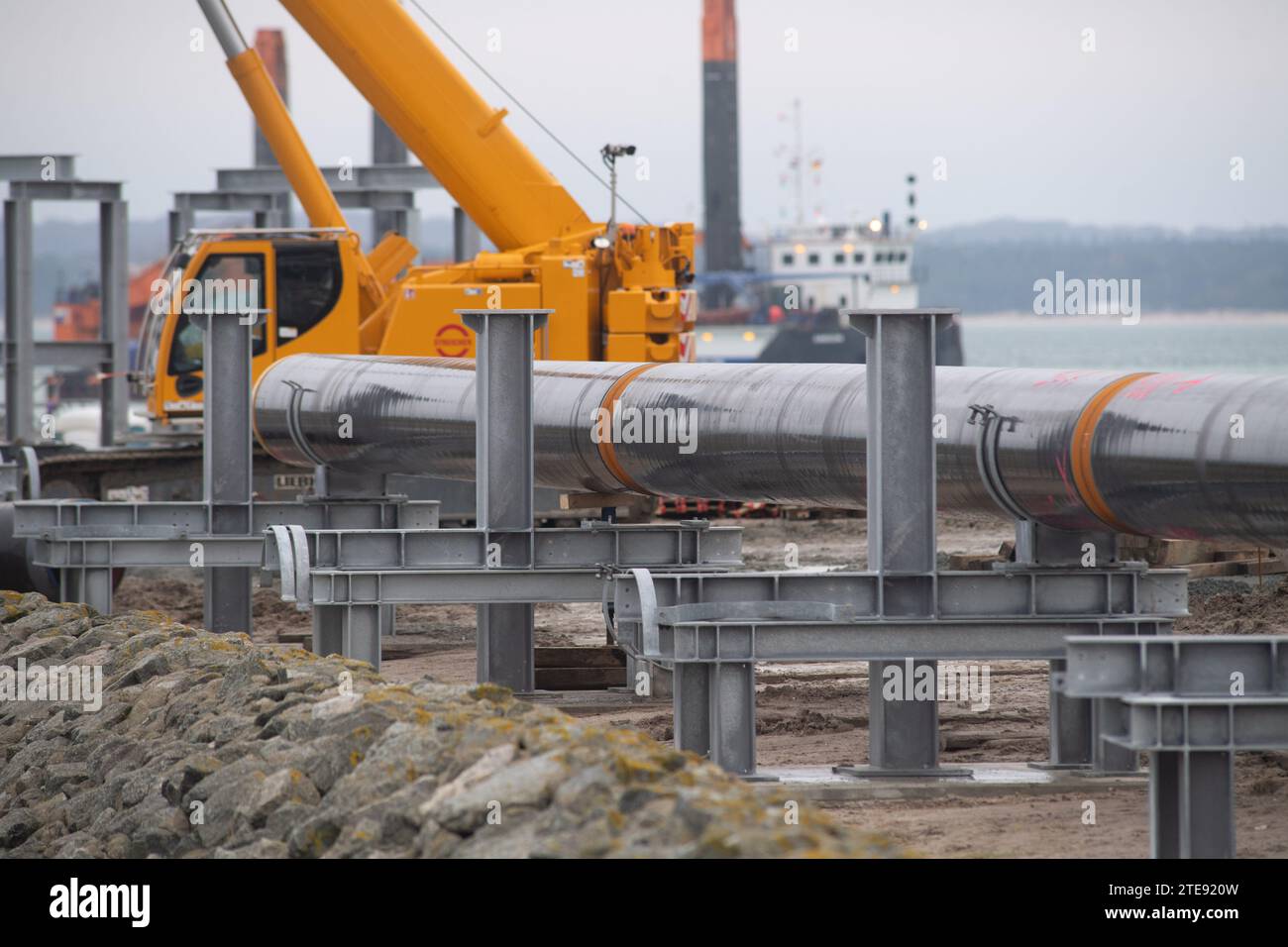Sassnitz Mukran, Germany. 18th Dec, 2023. Large pipes lie on the ...
